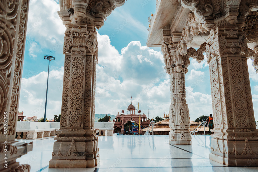 Beautiful view of carving on pillars of Swaminarayan temple with fluffy ...