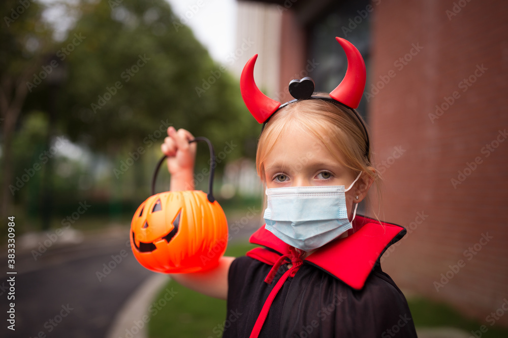 Portrait of cute Little Girl in costume of evil at home. Happy ...