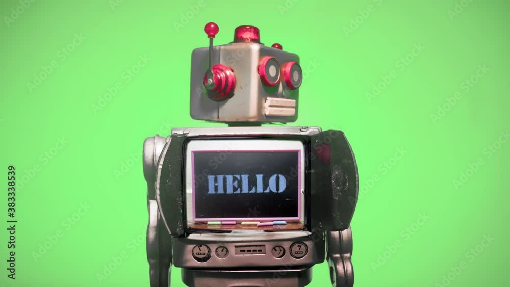 Retro robot toy with a spinning head and a message HELLO on a ...