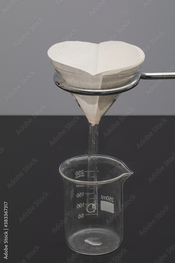 Filter paper in laboratory. Scientists are chemical filtration by ...