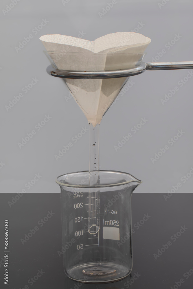 Filter paper in laboratory. Scientists are chemical filtration by ...