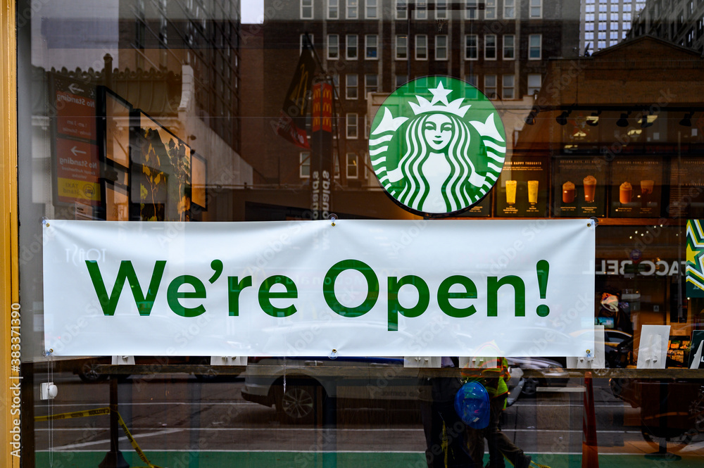 New York, New York, USA - October 5, 2020: Starbucks with a "We're Open ...
