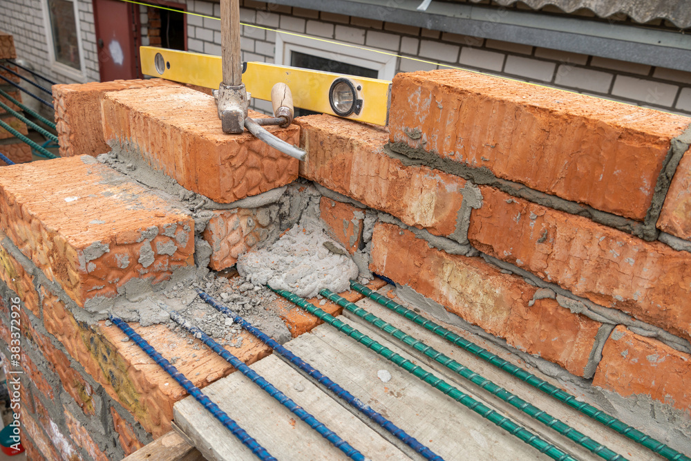 Reinforcement of masonry above windows using fiberglass reinforcement ...