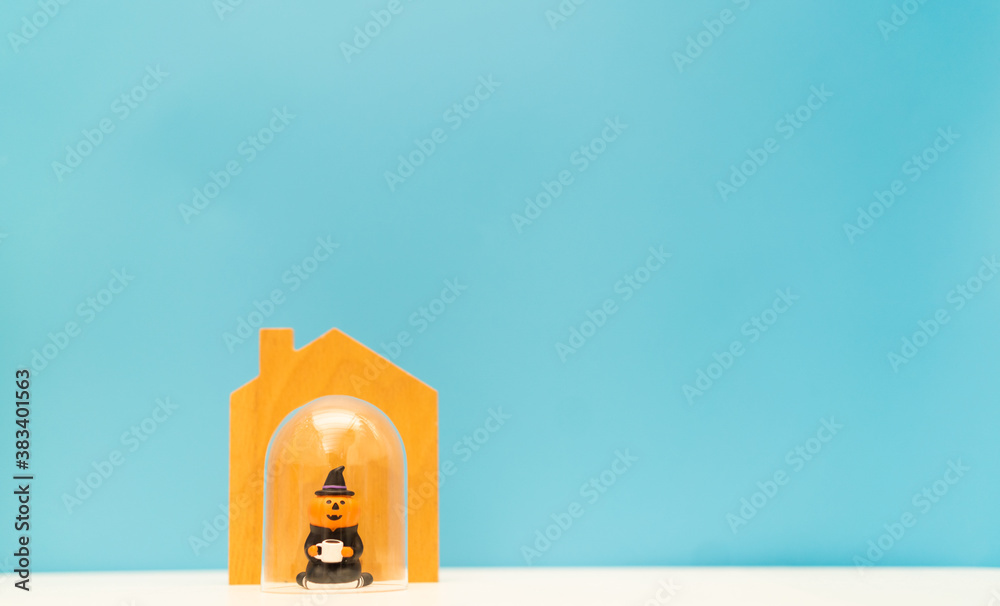 jack o lantern holding coffee cup stay home on black background.Stay ...