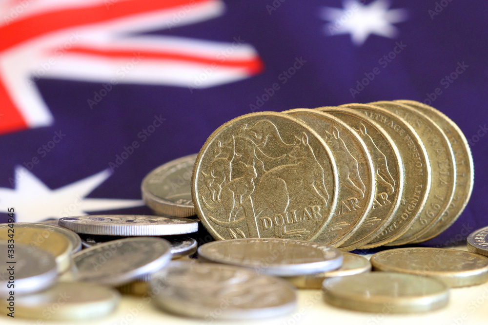 Australian one dollar coins with Australian flag as background. Stock ...