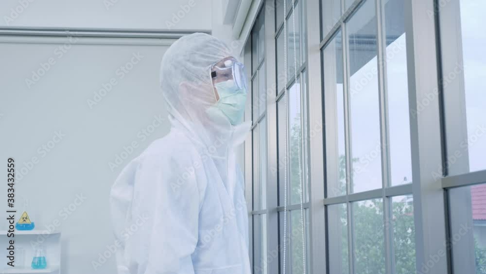 Asian man scientist is wearing Personal Protective Equipment (PPE ...