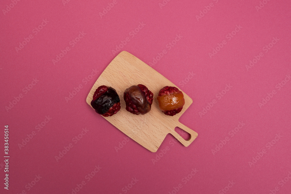 Healthy Oriental sweets. Halves of prunes, dried apricots and nuts are ...