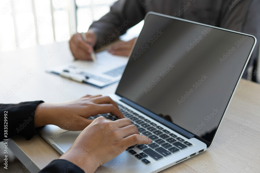 The head of the HR department is checking and Type on the keyboard ...