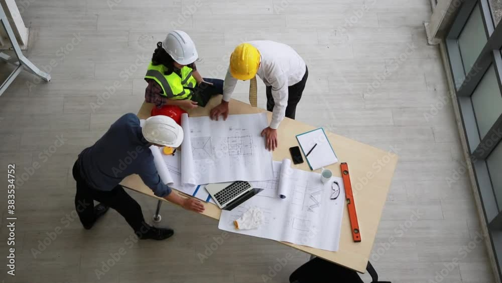 Team of engineers and architects working, planing, measuring layout of ...