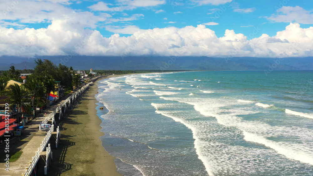 The coast with hotels and tourists, a famous place for surfing in the ...