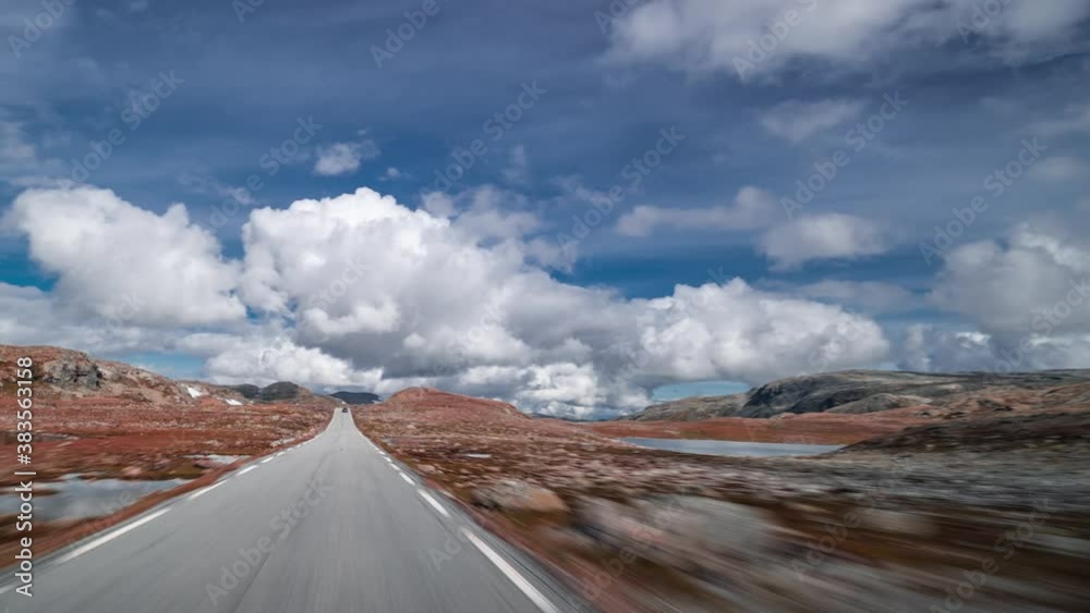 A drive on Aurlandsfjellet road in Norway. Narrow two lane freeway ...