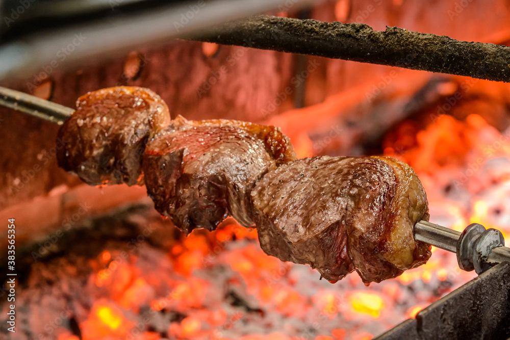 Picanha barbecue roasted over hot coals. This form of barbecue is ...
