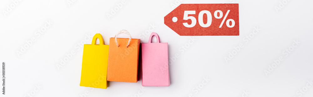 Horizontal image of toy shopping bags with red price tag with 50 ...