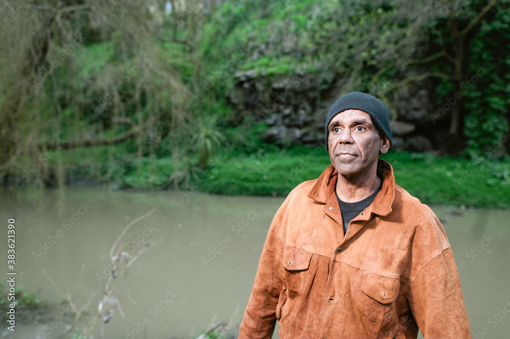 Aboriginal Man in his Forties Standing by River Stock Photo | Adobe Stock