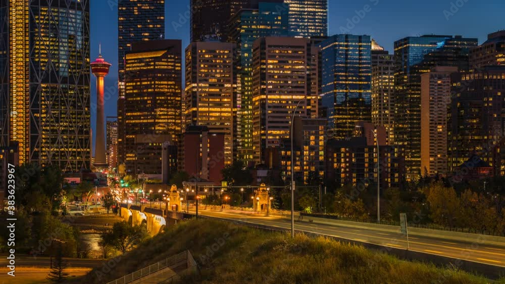 Day to night timelapse view of traffic and modern high rise buildings ...