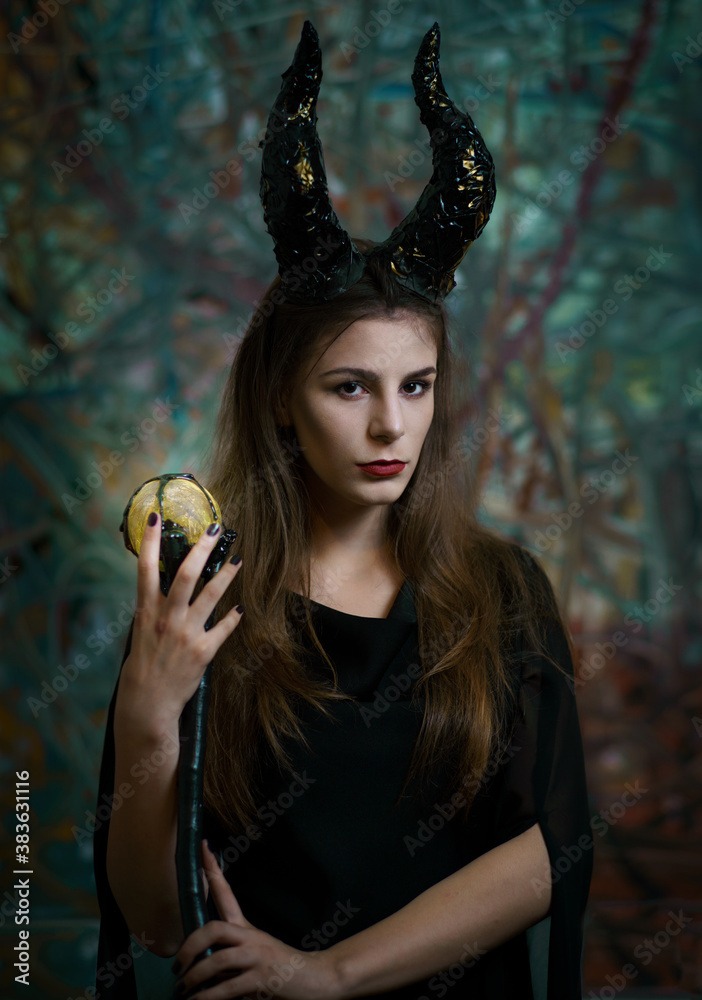 Maleficent demonic. young pretty dressed as a fairy with horns and ...