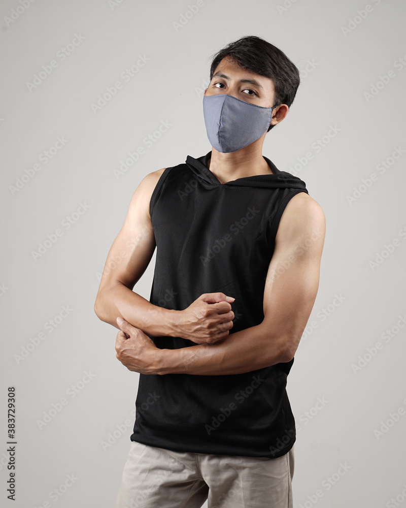 Young men in empty black Tanktop and wearing health masks, dress up and ...