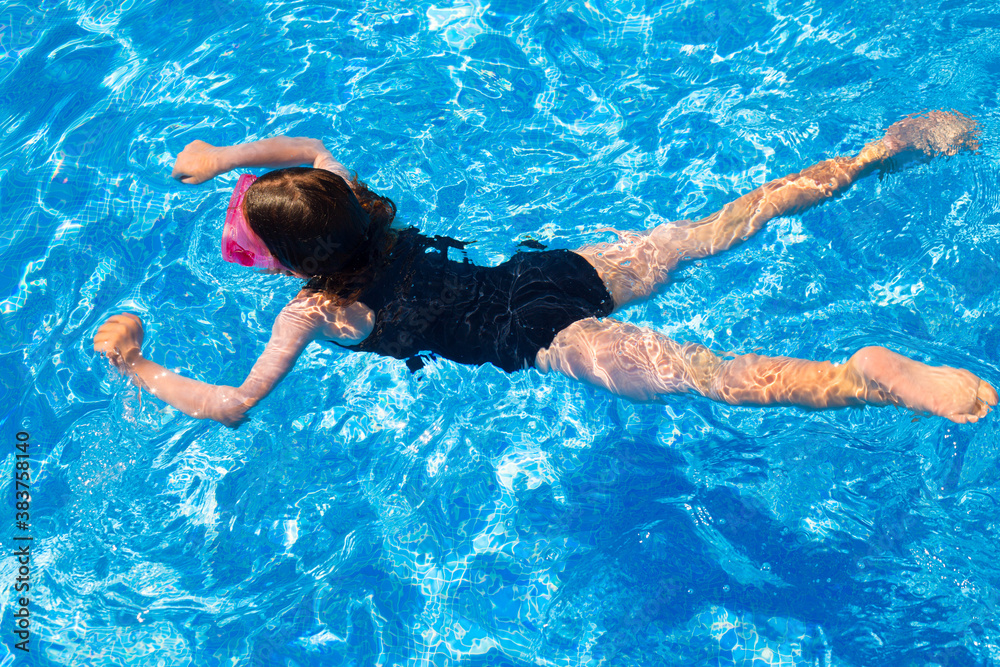 bikini kid girl swimming on blue tiles pool in summer Stock Photo ...