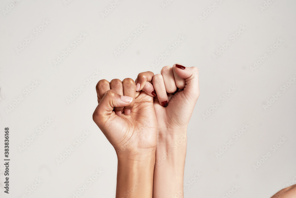 Poster Close up of two female hands making a pinkie promise sign ...