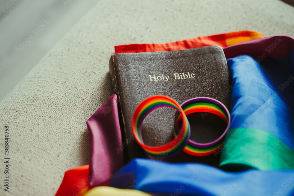 The Holy Bible on rainbow flags, which are the colors that the ...