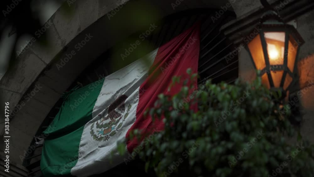 Mexican Flag Hanging Over a Building Arched Entrance Stock Video ...