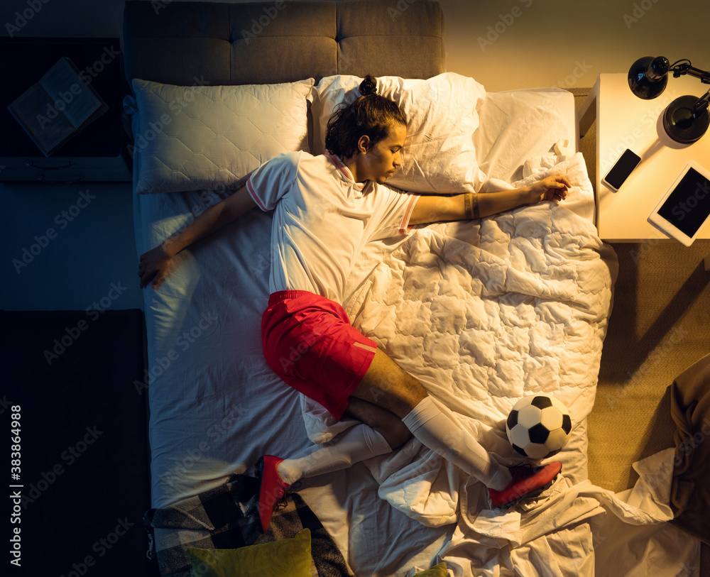 In love. Top view of young professional football, soccer player ...