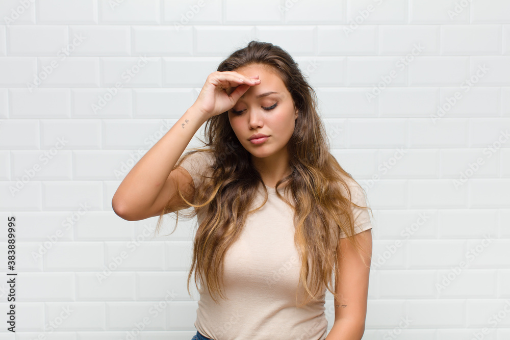looking stressed, tired and frustrated, drying sweat off forehead ...