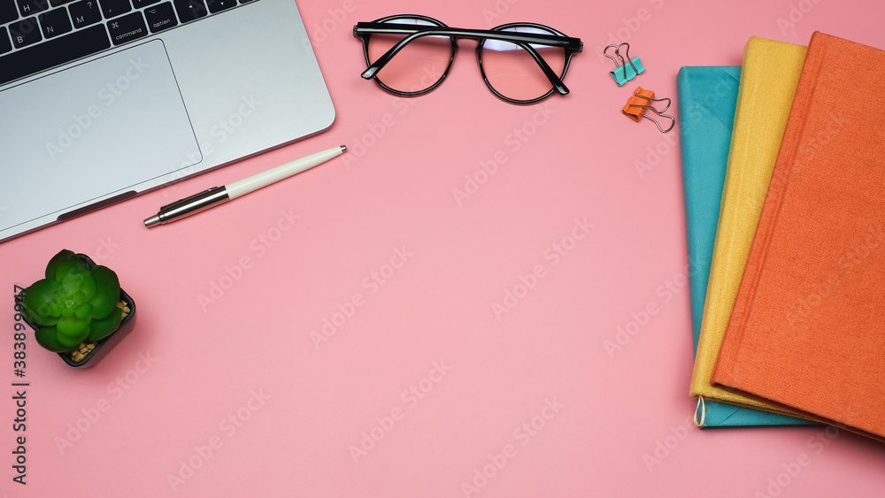 Flat lay, black to school and technology education concept on pink ...