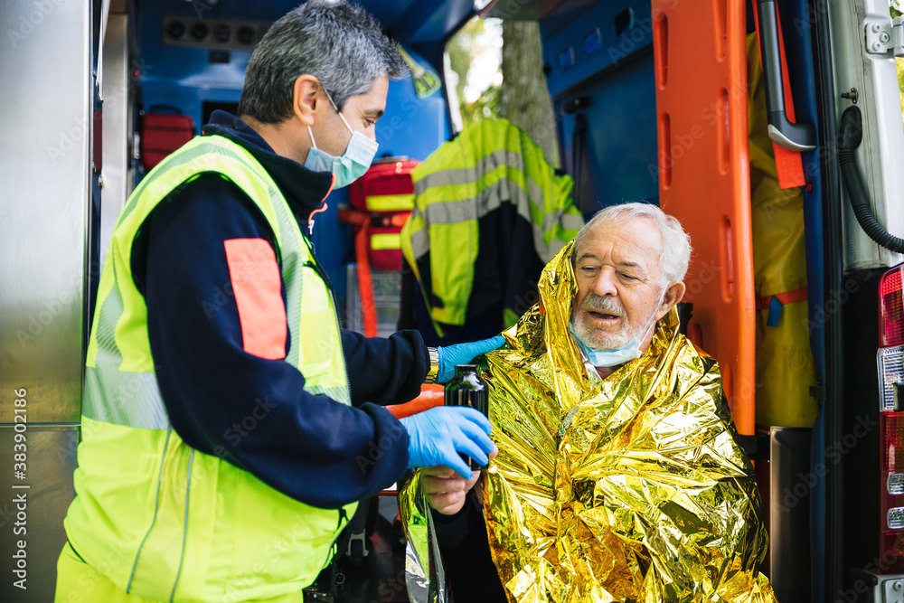 Paramedic rescues an elderly person in distress with an ambulance by ...