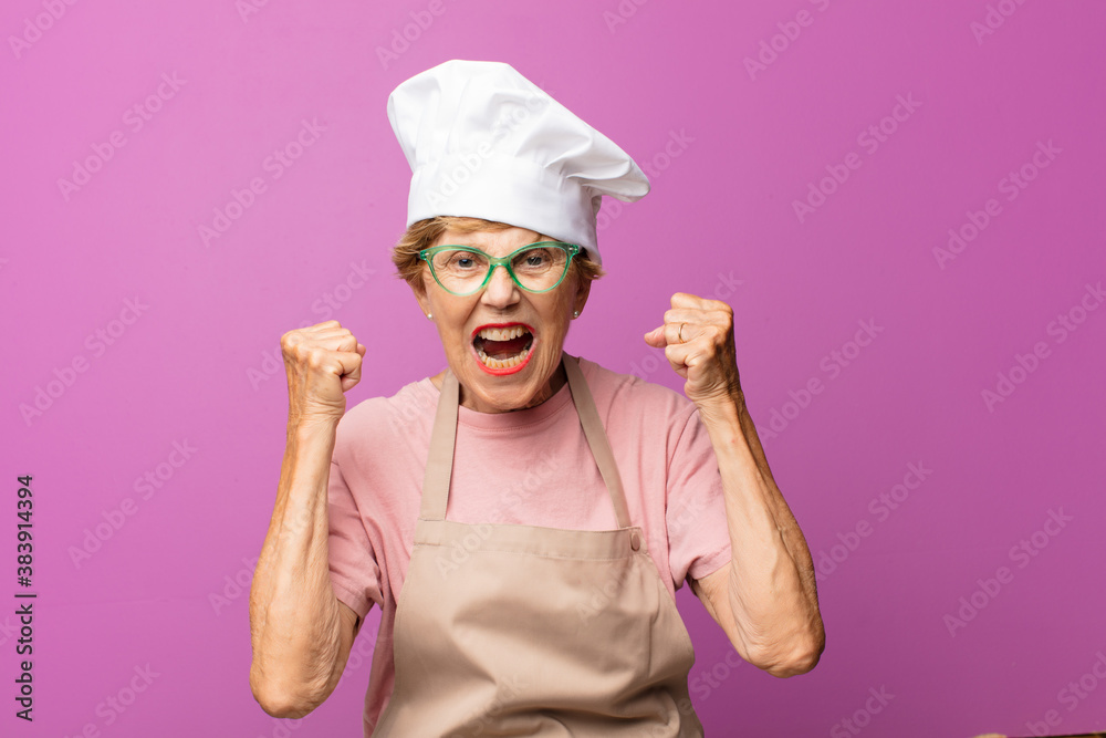 mature beautiful old woman shouting aggressively with an angry ...