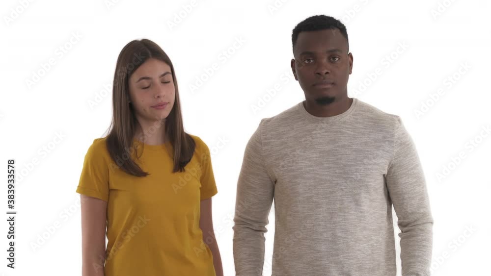 African man staring on something and his Caucasian girlfriend slapping ...