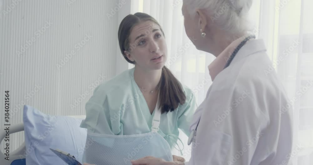 Broken arm patients being treated. Doctor is explaining about arm pain ...
