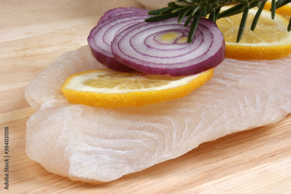 raw vietnamese river cobbler fillet on a timber board Stock Photo ...