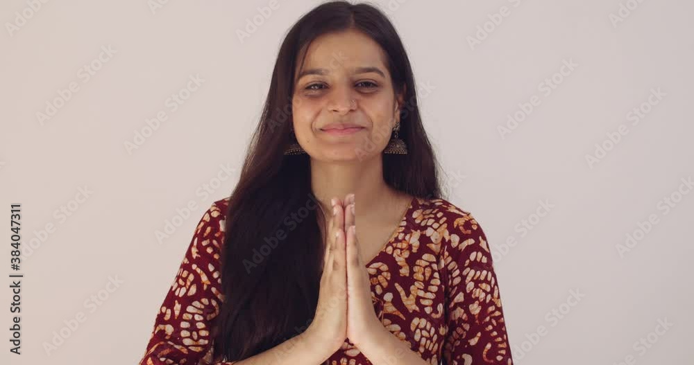 Indian woman welcomes greet goodbyes with hand joining Namaste greeting ...