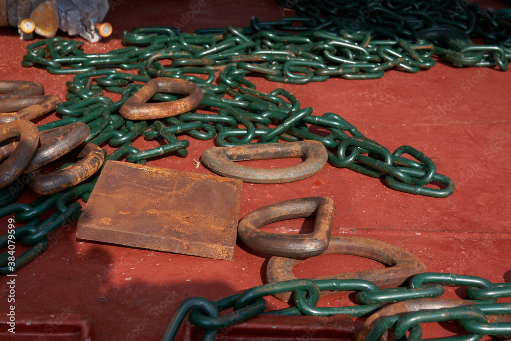 Cargo lashing chains, stoppers and d-rings on deck of merchant cargo ...