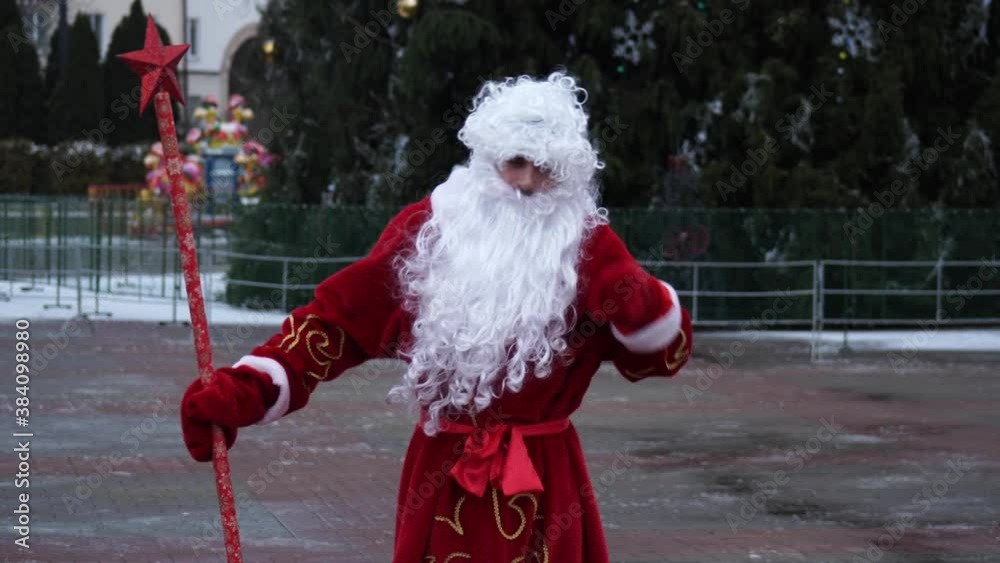 Stockvideo Russian Father Christmas like a Santa Claus takes off his ...