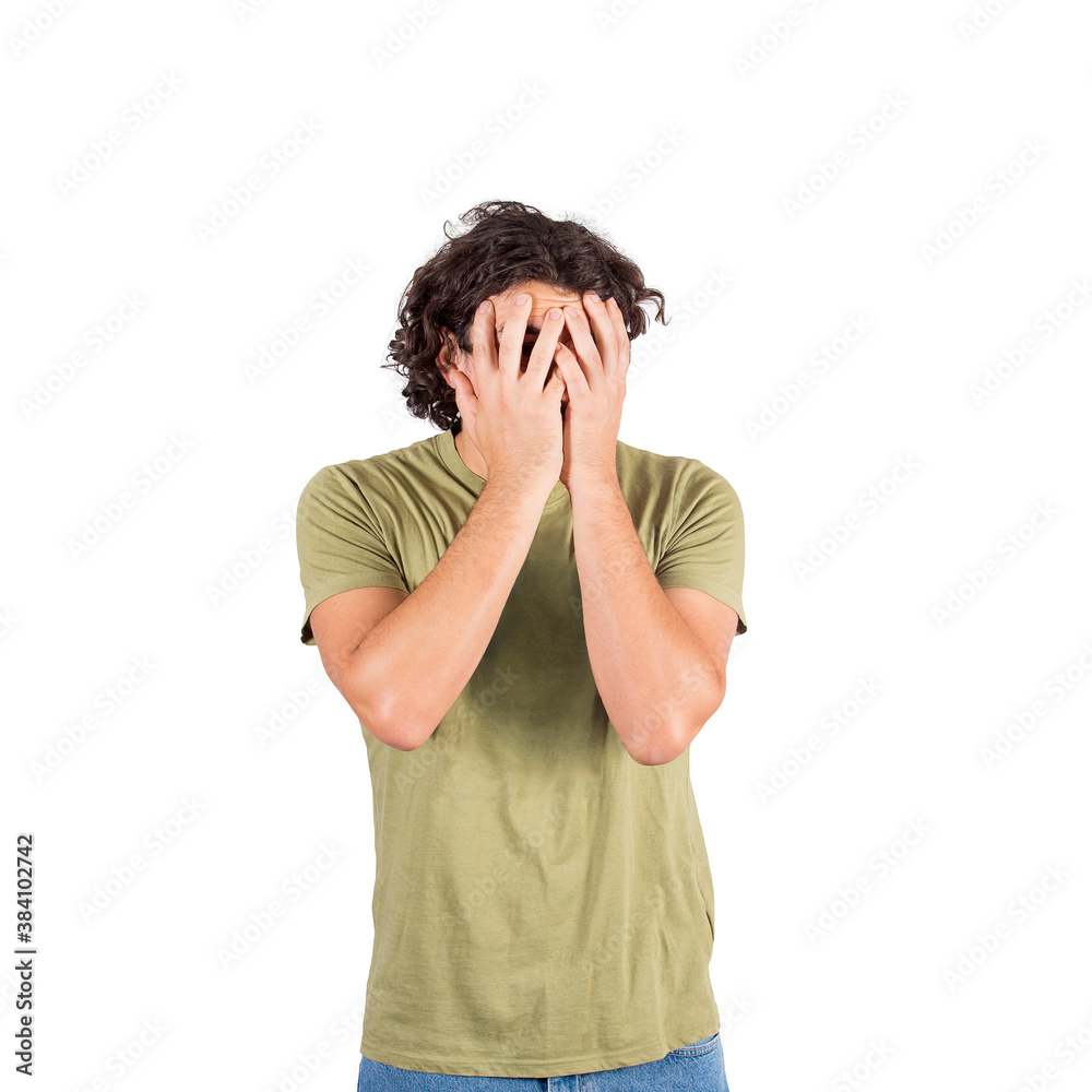 Portrait of scared young man, long curly hair style, looking through ...