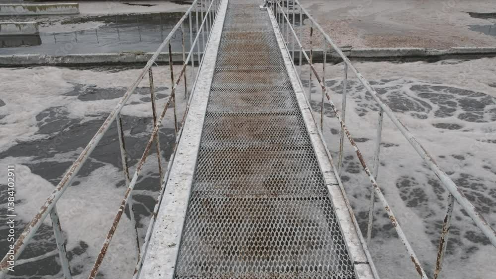 Bridge at the water treatment plant facility. Aeration station. Round ...