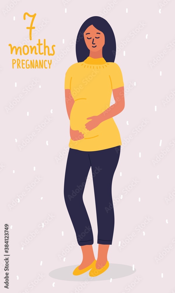 Young white pregnant woman. Third trimester of pregnancy. She strokes ...
