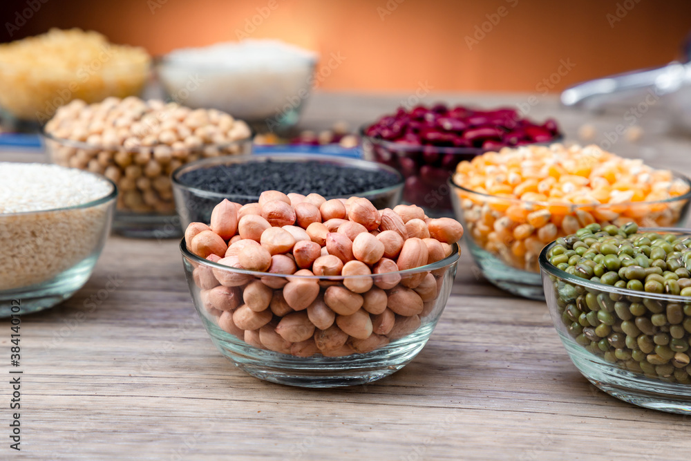 Peanuts in a bowl wood table. The peanut also known as the groundnut or ...