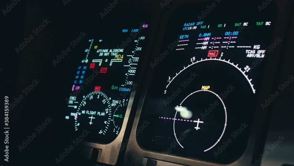 Aircraft cockpit instruments turned on and becoming to life in dark ...