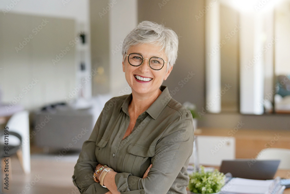 Portrait Of A Beautiful Smiling 55 Year Old Woman With White Hair Stock