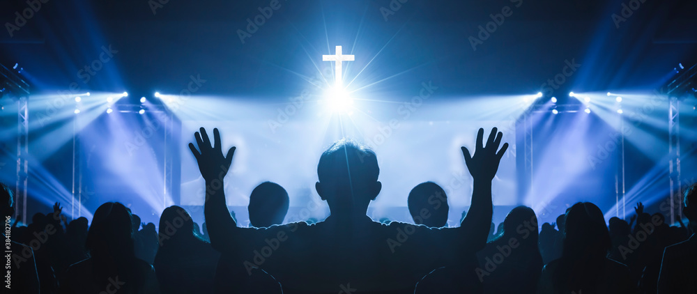 Church worship concept: Christian worship with raised hand at the at ...