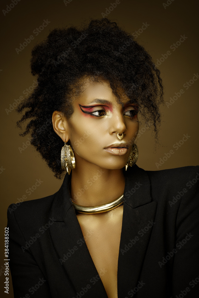 Beautiful afro girl wearing a blazer and gold jewelry Stock Photo ...