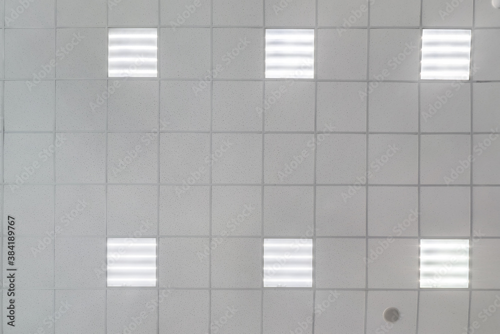 cassette suspended ceiling with square halogen spots lamps and drywall ...