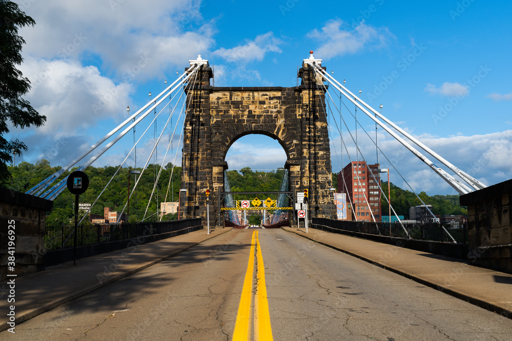 This shows the approach roadway and masonry tower of the historic ...