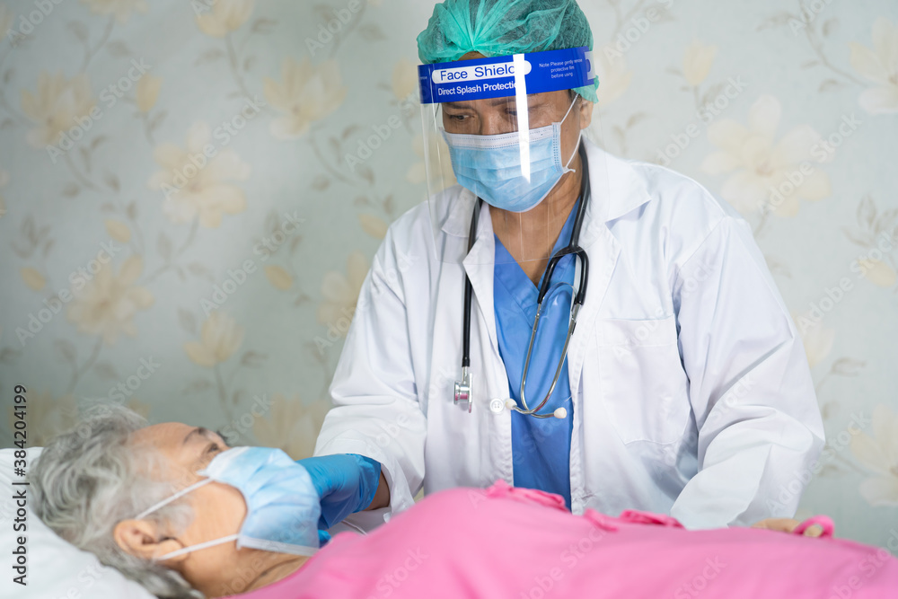 Asian doctor wearing face shield and PPE suit new normal to check ...