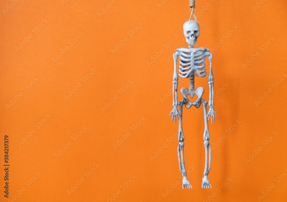 hanged skeleton on an orange background for the holiday halloween Stock ...
