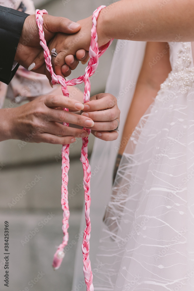 hand-fasting ceremony at an Irish wedding, traditional Celtic hand ...