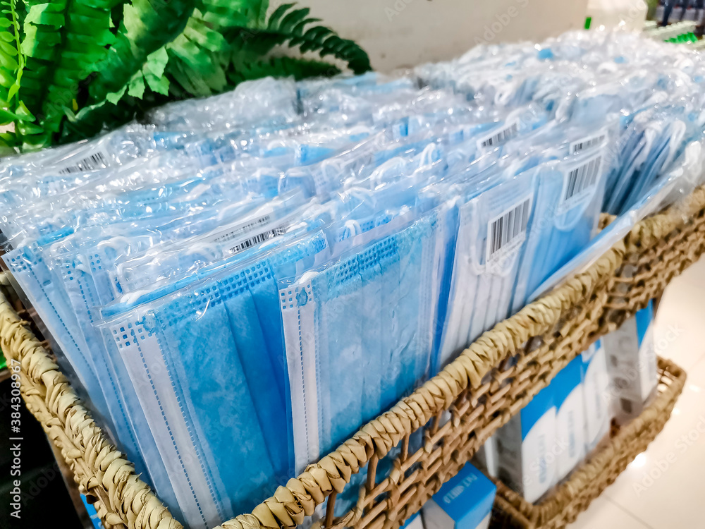 Surgical masks individually placed in single clear plastic packs in a ...